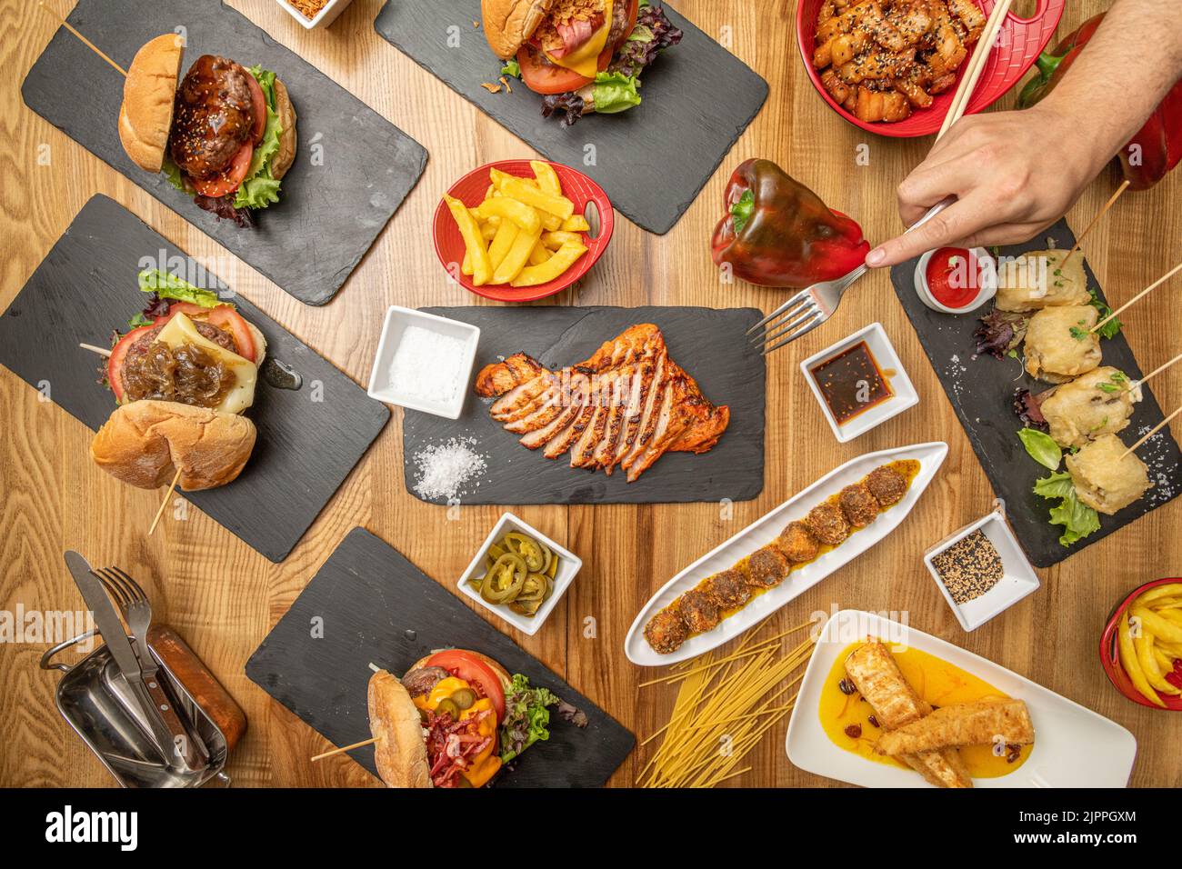 Set of Spanish tapas dishes, assorted burgers, grilled meat, croquettes ...