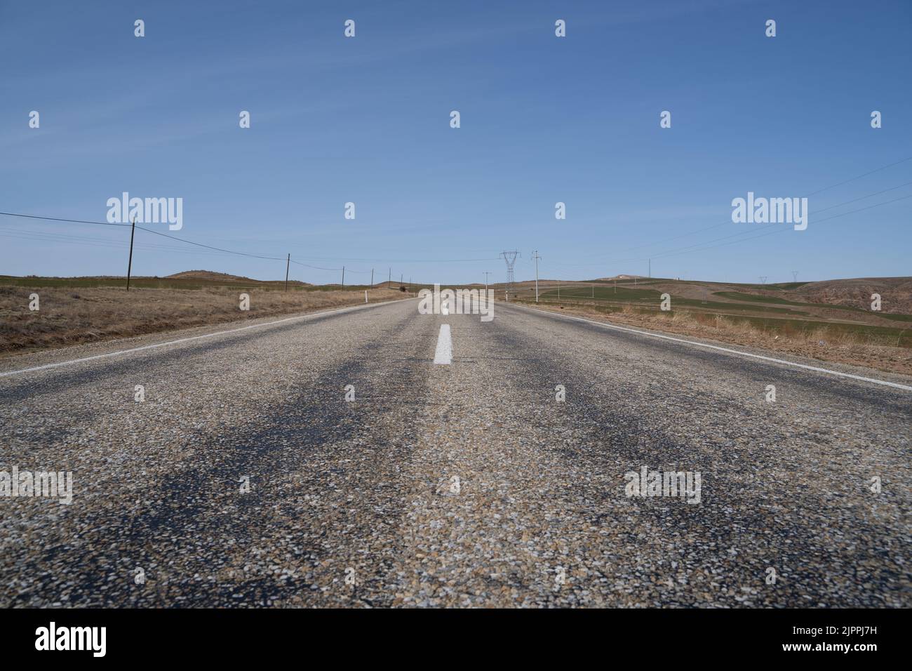 Double lane straight road and blue sky Stock Photo - Alamy