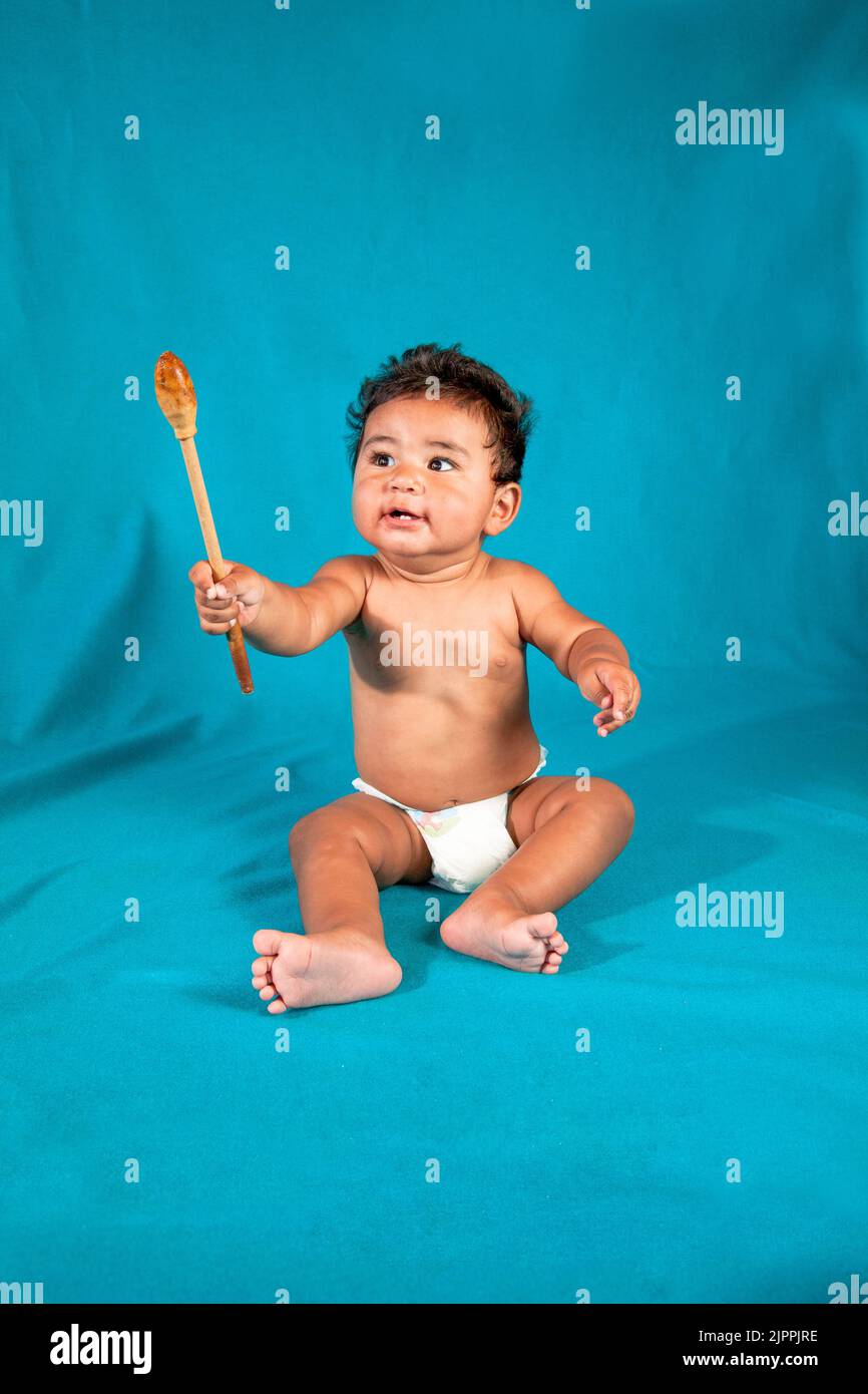 Native American baby, from the Santa Clara Pueblo in New Mexico plays ...