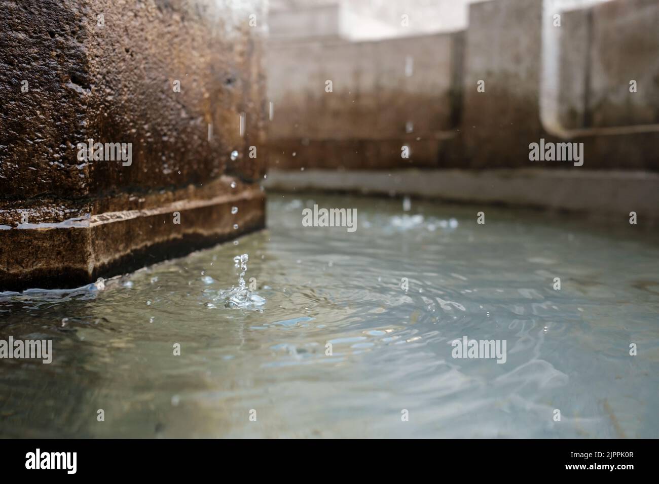 Water drops in an old stone European drying fountain Stock Photo - Alamy