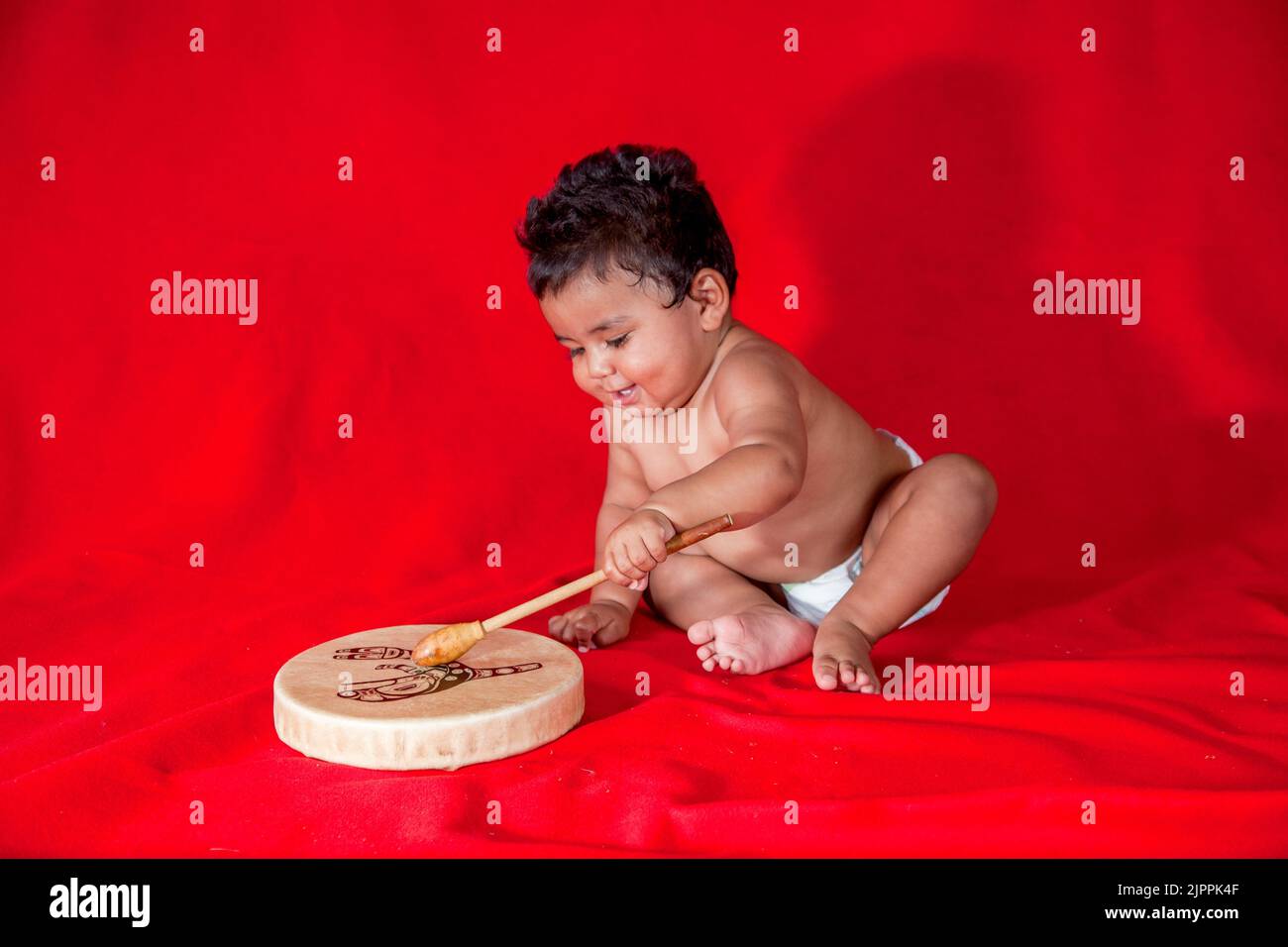 Native American baby, from the Santa Clara Pueblo in New Mexico, plays ...