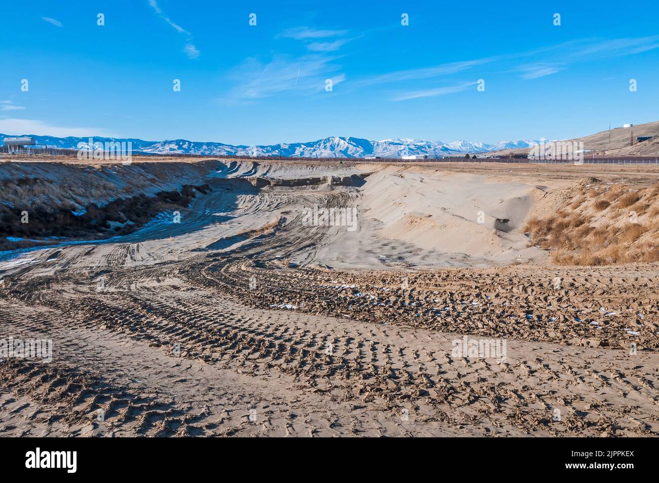 Tire and tread tracks are quite evident in the soil of an active solid ...