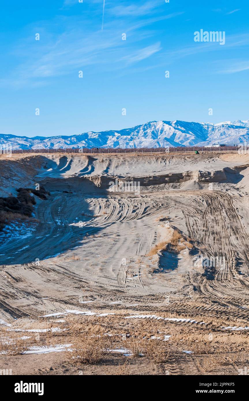 Tire and tread tracks are quite evident in the soil of an active solid ...