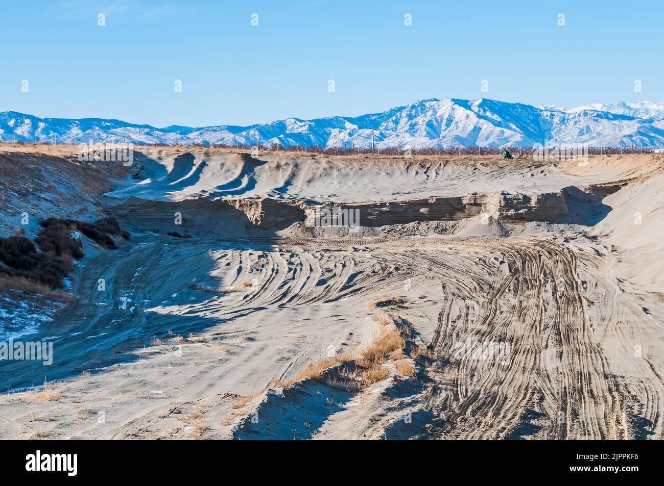 Tire and tread tracks are quite evident in the soil of an active solid ...