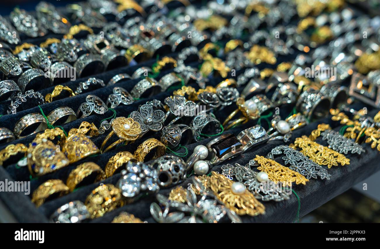 Gold and silver jewelry in store window display Stock Photo - Alamy