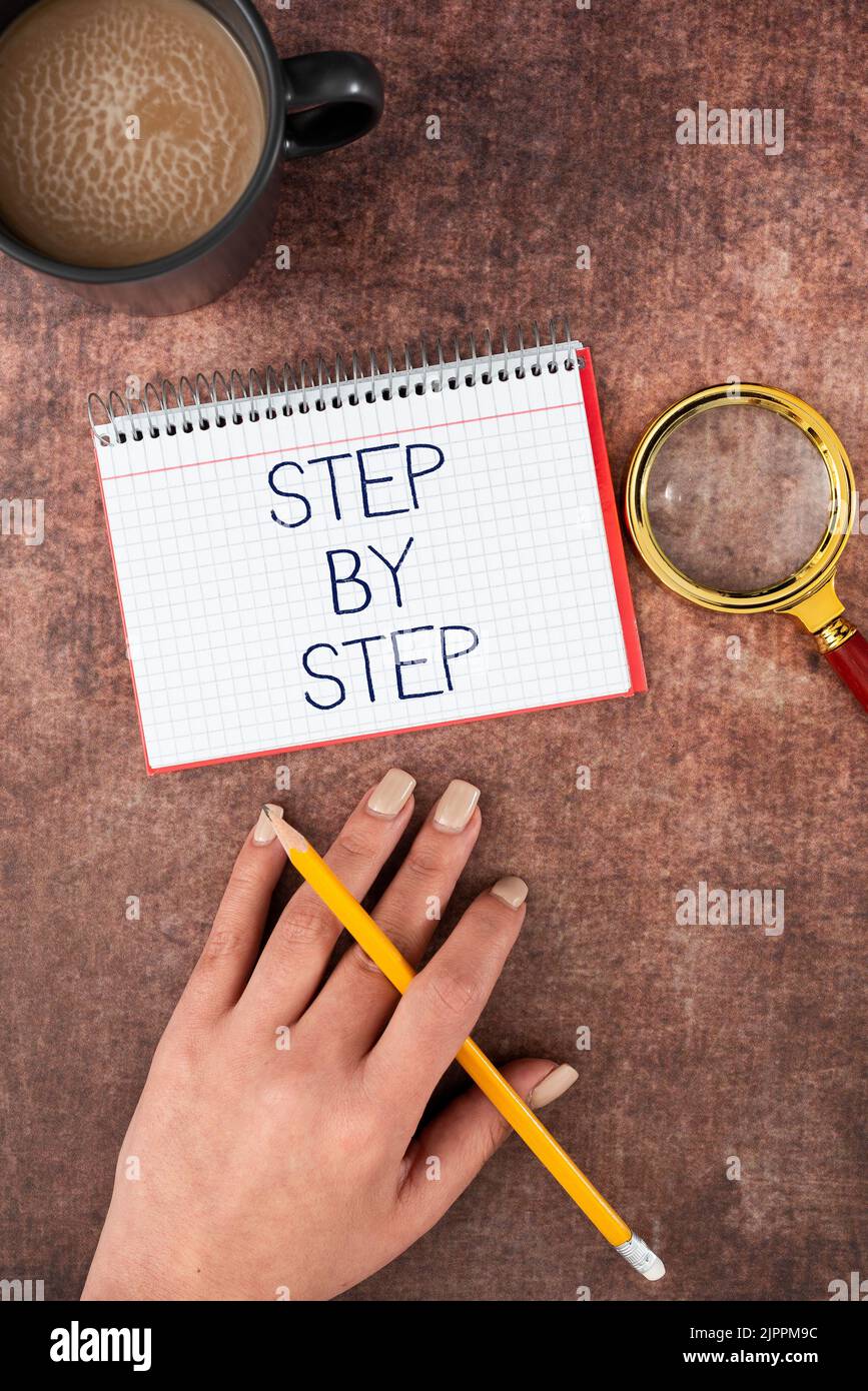 Sign displaying Step By Step, Word Written on Slow progress Road to ...