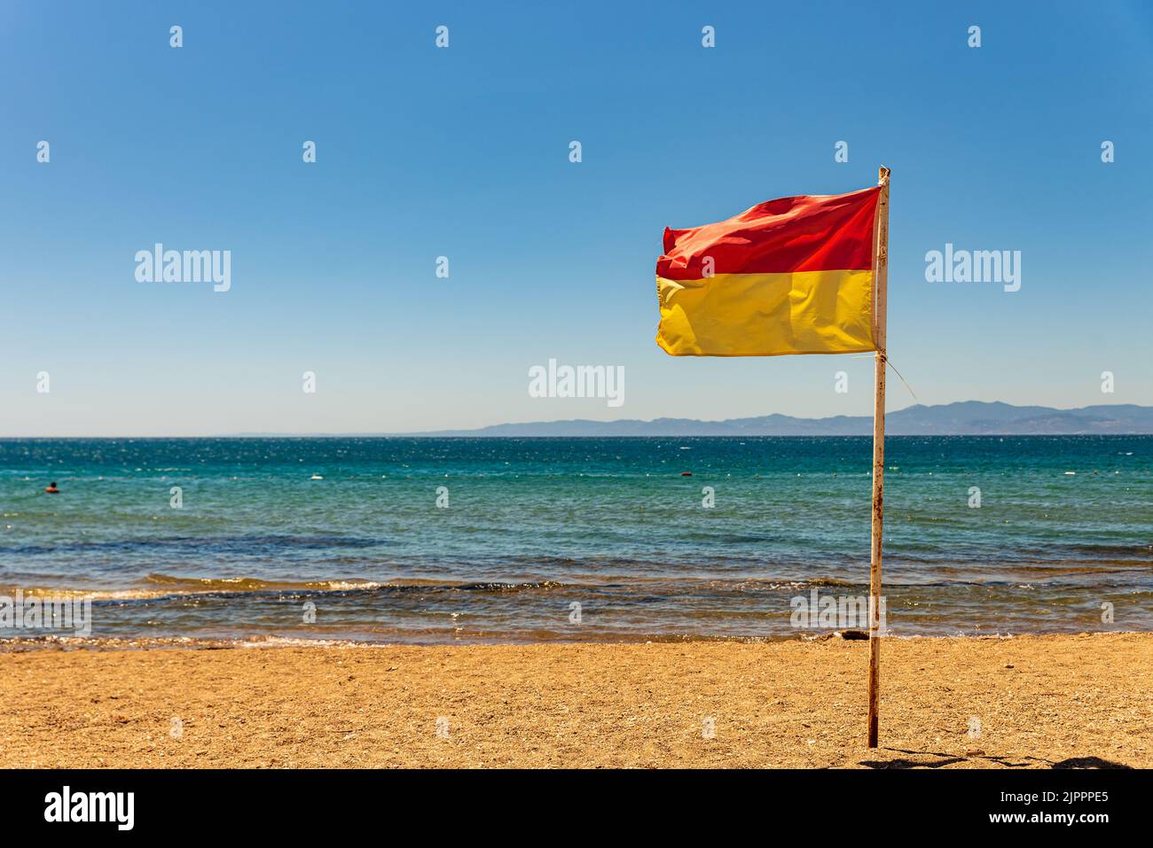 lifeguard icon on the beach , lifeguard flag waving in the wind to ...
