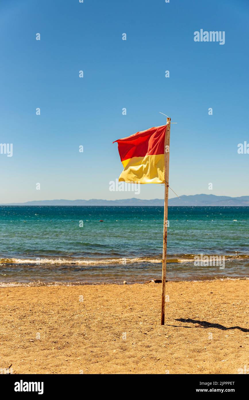 lifeguard icon on the beach , lifeguard flag waving in the wind to ...