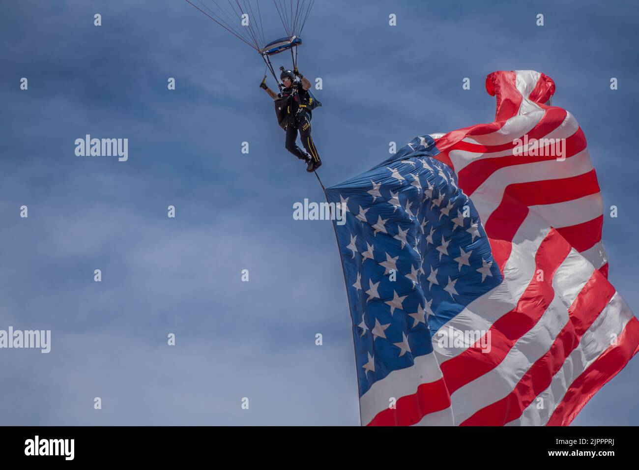 Members of the U.S. Navy Parachute Team, the Leap Frogs, fly the ...