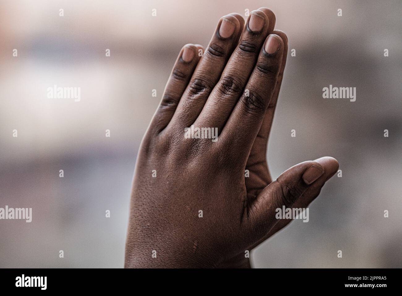 Hands together praying sign Stock Photo - Alamy