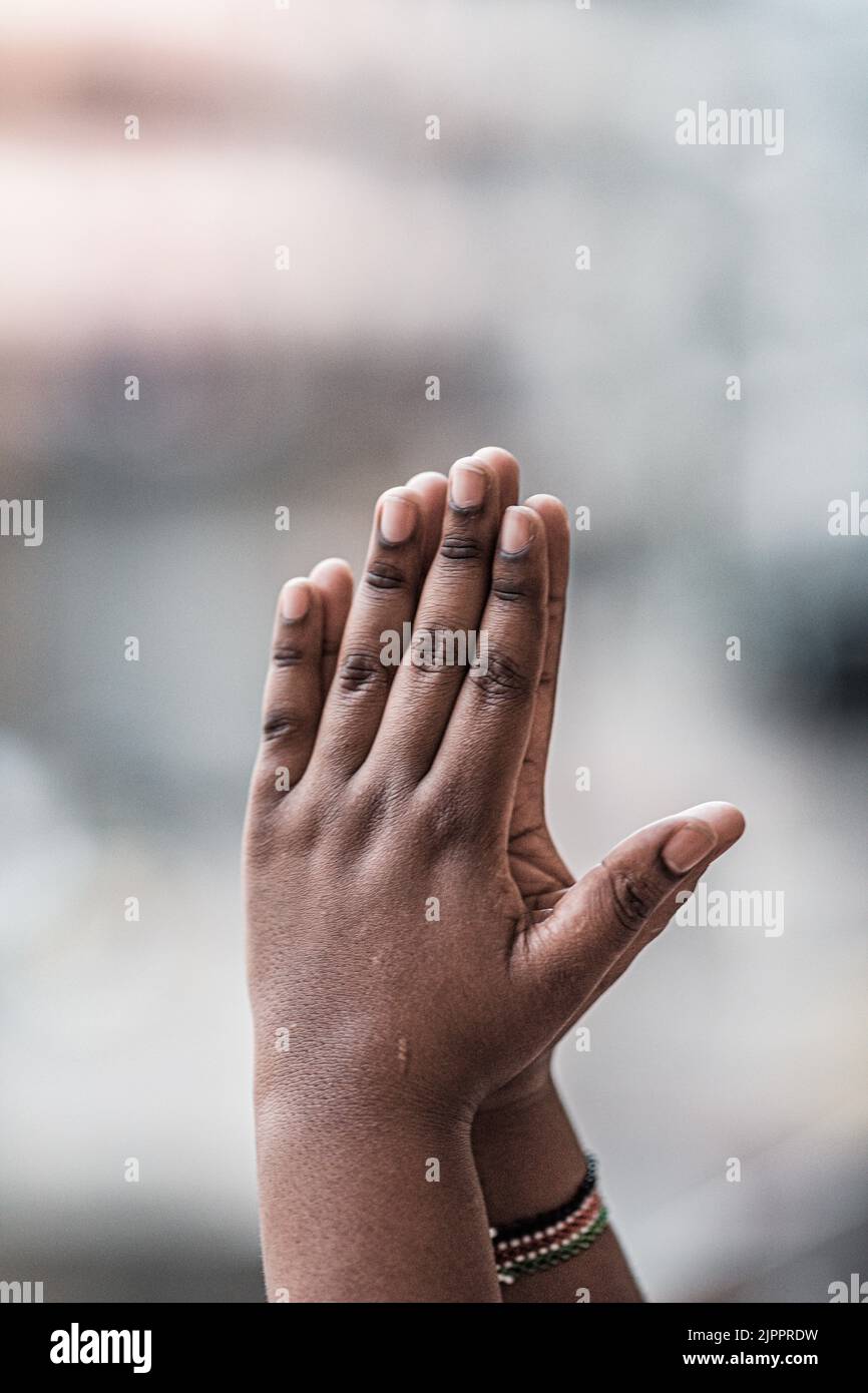 Hands together praying sign Stock Photo - Alamy