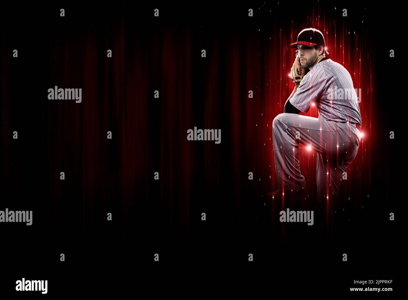 Baseball Player, pitcher, in a red uniform, on a black and red ...