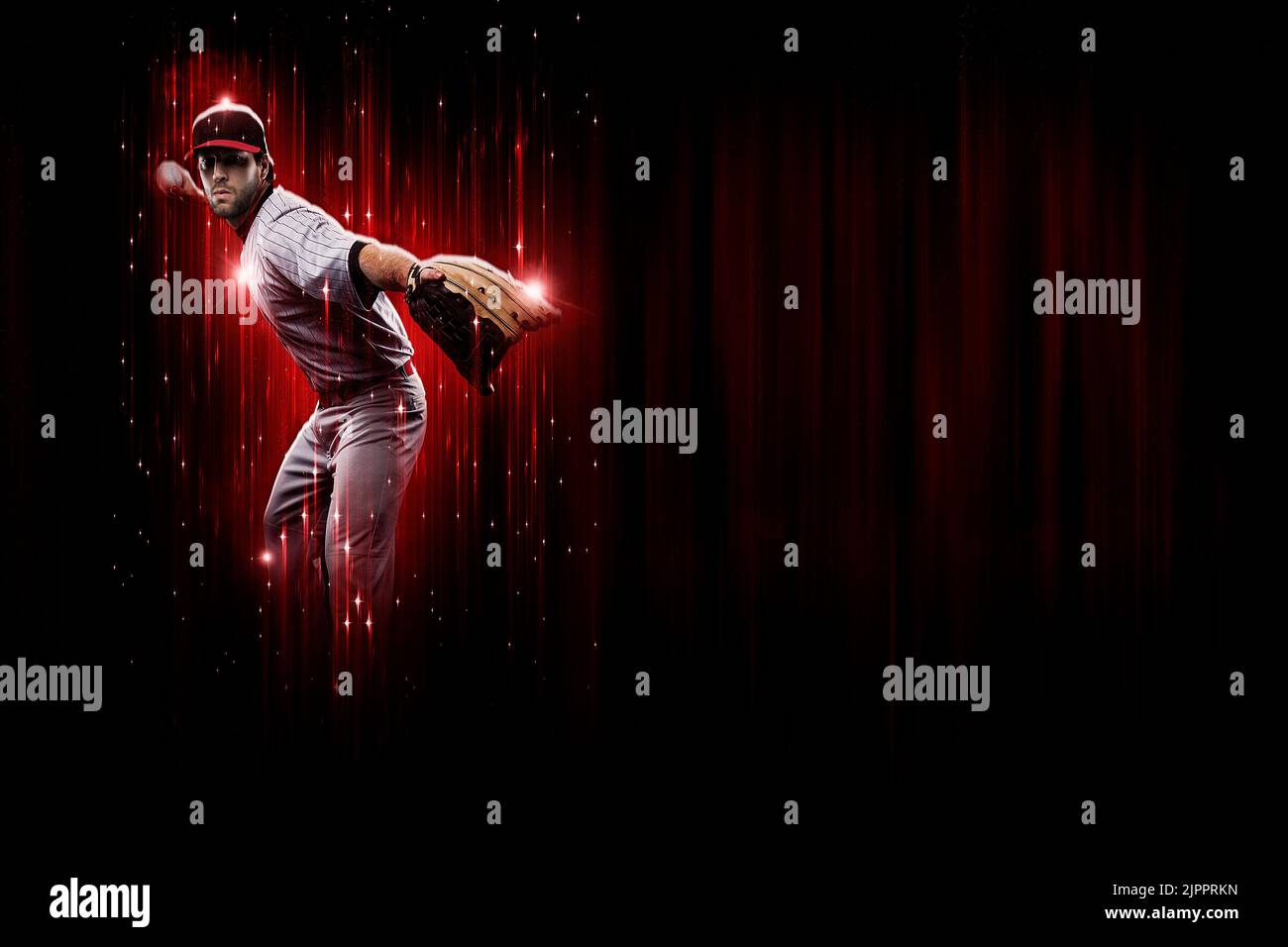 Baseball Player, pitcher, in a red uniform, on a black and red ...