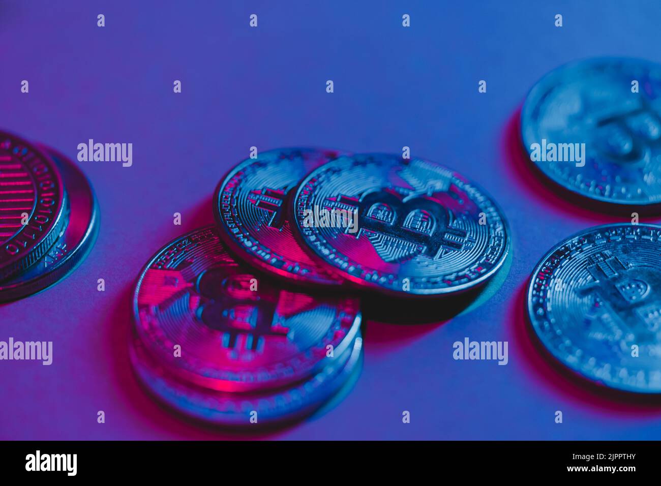 Bitcoin coins under neon light. The currency of the future Stock Photo ...