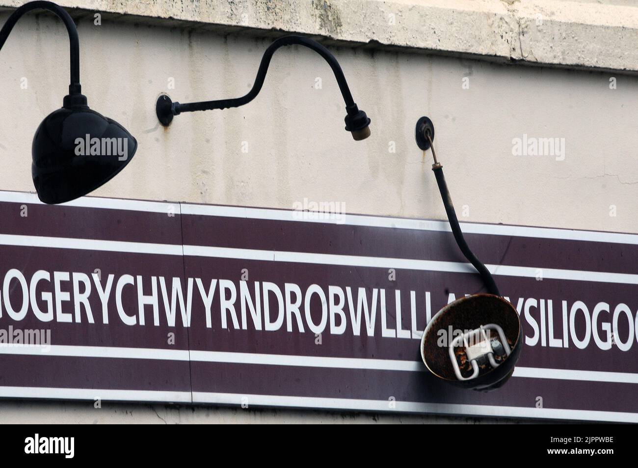 RUSTING LIGHTS HANG OVER THE FAMOUS SIGN AT THE DELAPIDATED STATION ...
