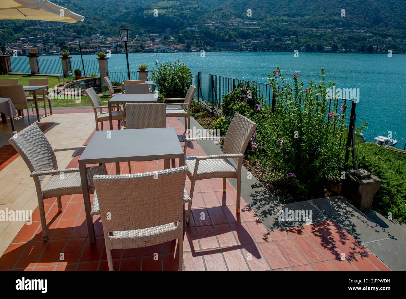 Terrace with armchairs overlooking the lake Stock Photo - Alamy