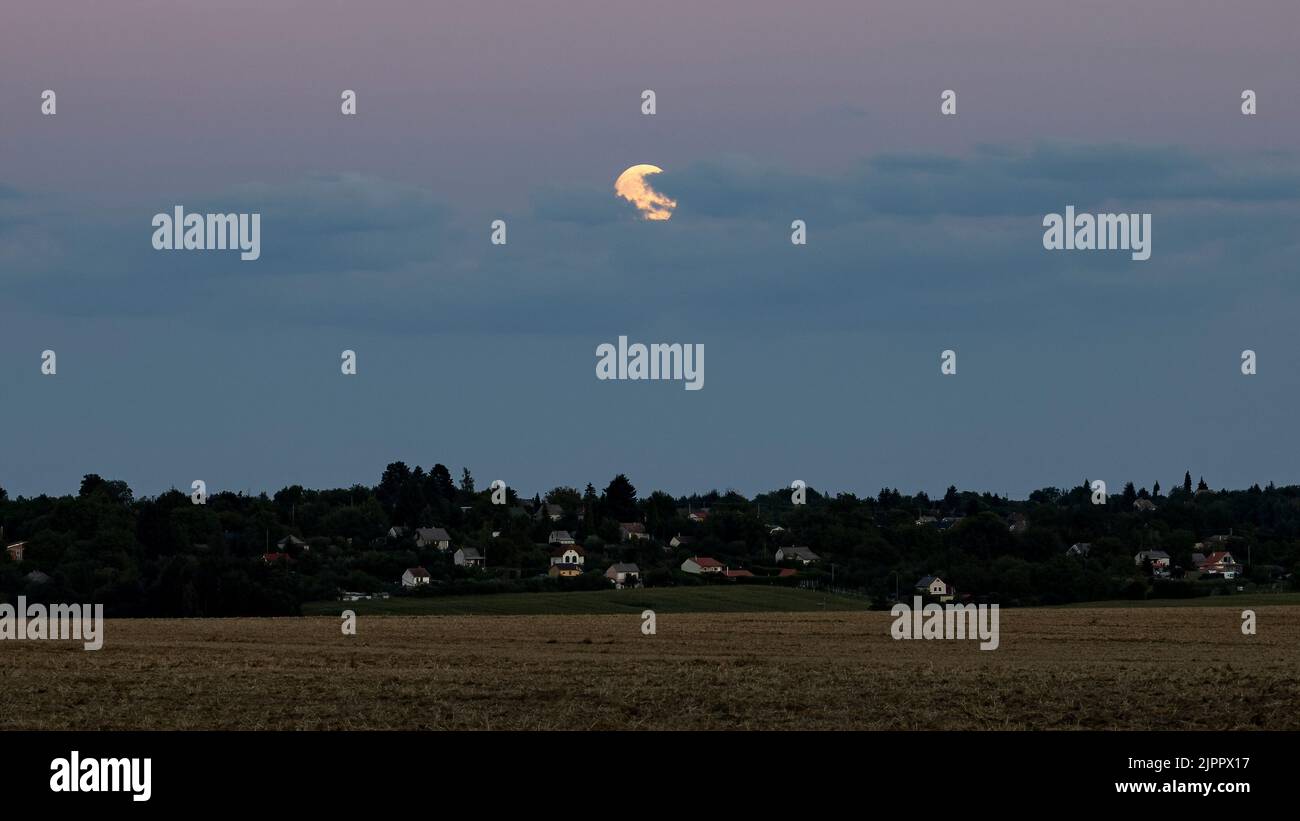 Moon hiding behind trees hi-res stock photography and images - Alamy