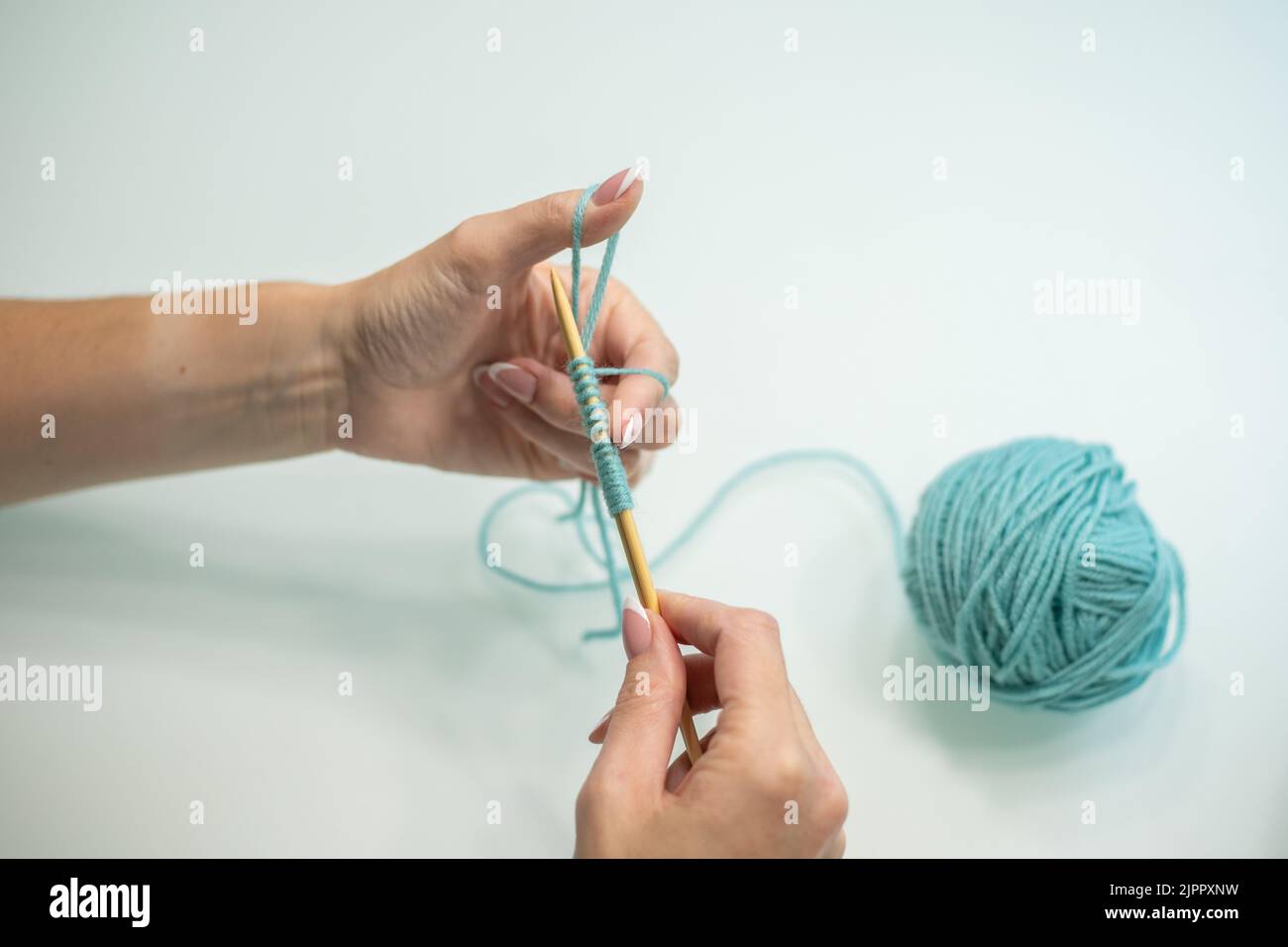 set of loops on the needles step by step. wool and cotton knitting ...