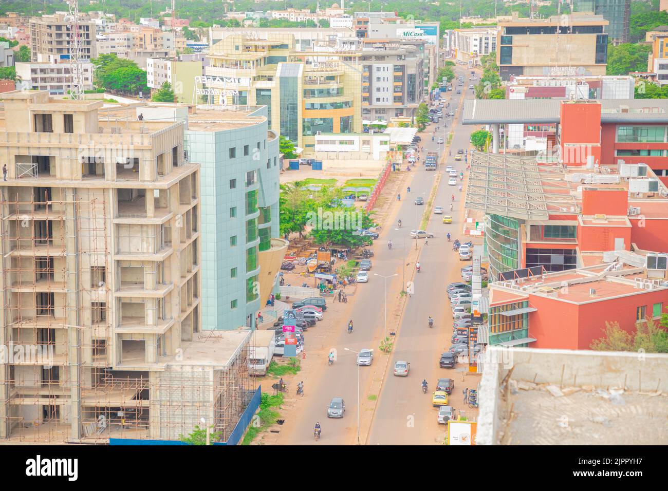 A busy street in the Republic of Mali in West Africa with cars,cyclists ...