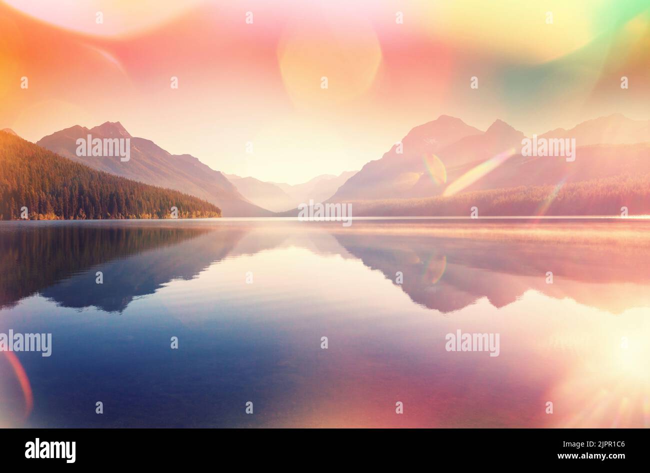 Beautiful Bowman lake with reflection of the spectacular mountains in ...