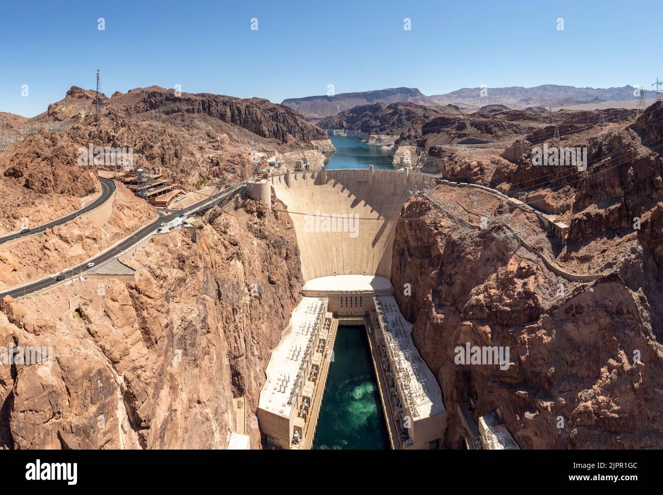 high view of the Hoover Dam in a sunny day between the states of ...