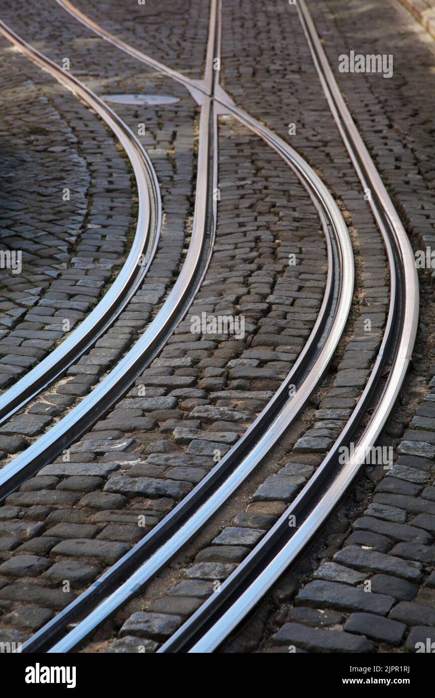 A vertical view of train tracks made of steel and cobble stones Stock ...