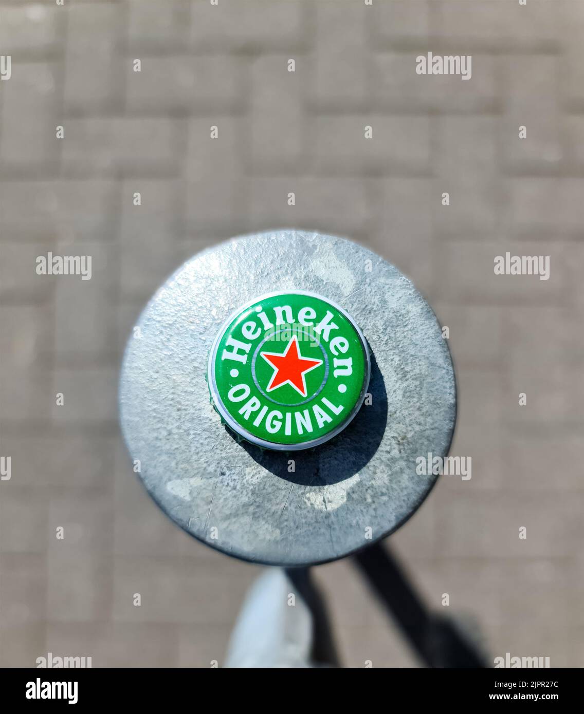 Kiel, Germany - 20. August 2022: A crown cap of a bottle of Heineken ...