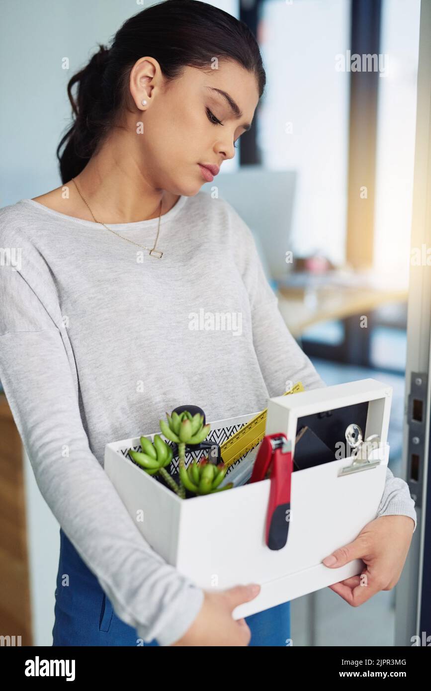 Shes hit a dead-end in her career. an unhappy businesswoman holding her ...