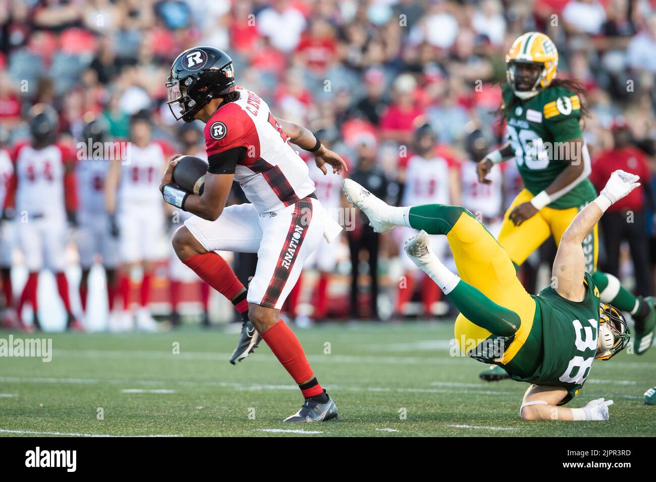 August 19, 2022: Ottawa Redblacks quarterback Caleb Evans (5) runs for ...
