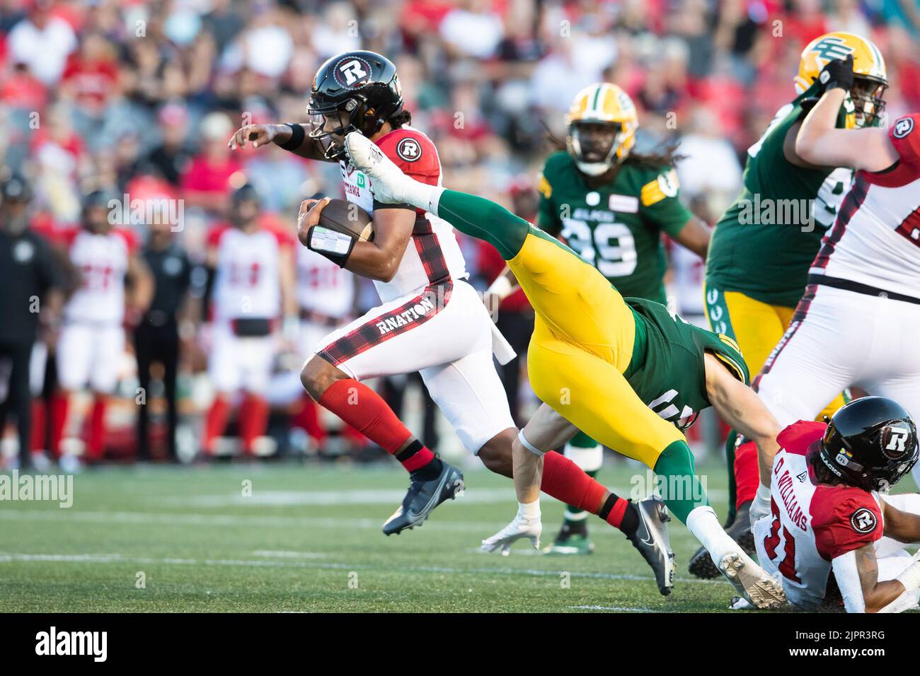 August 19, 2022: Ottawa Redblacks quarterback Caleb Evans (5) runs for ...