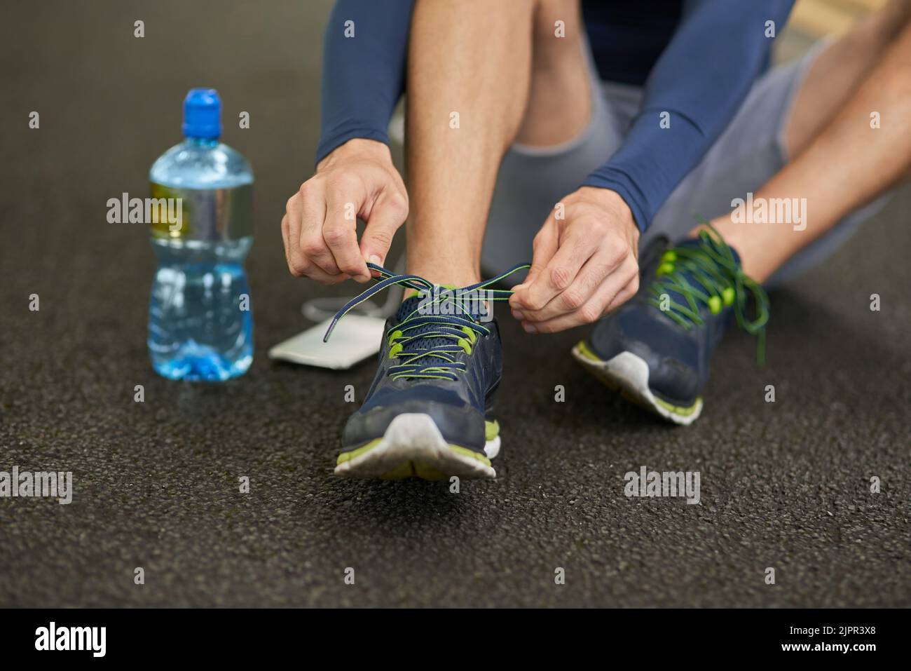 Making sure theyre laced nice and tight. High angle shot of an ...