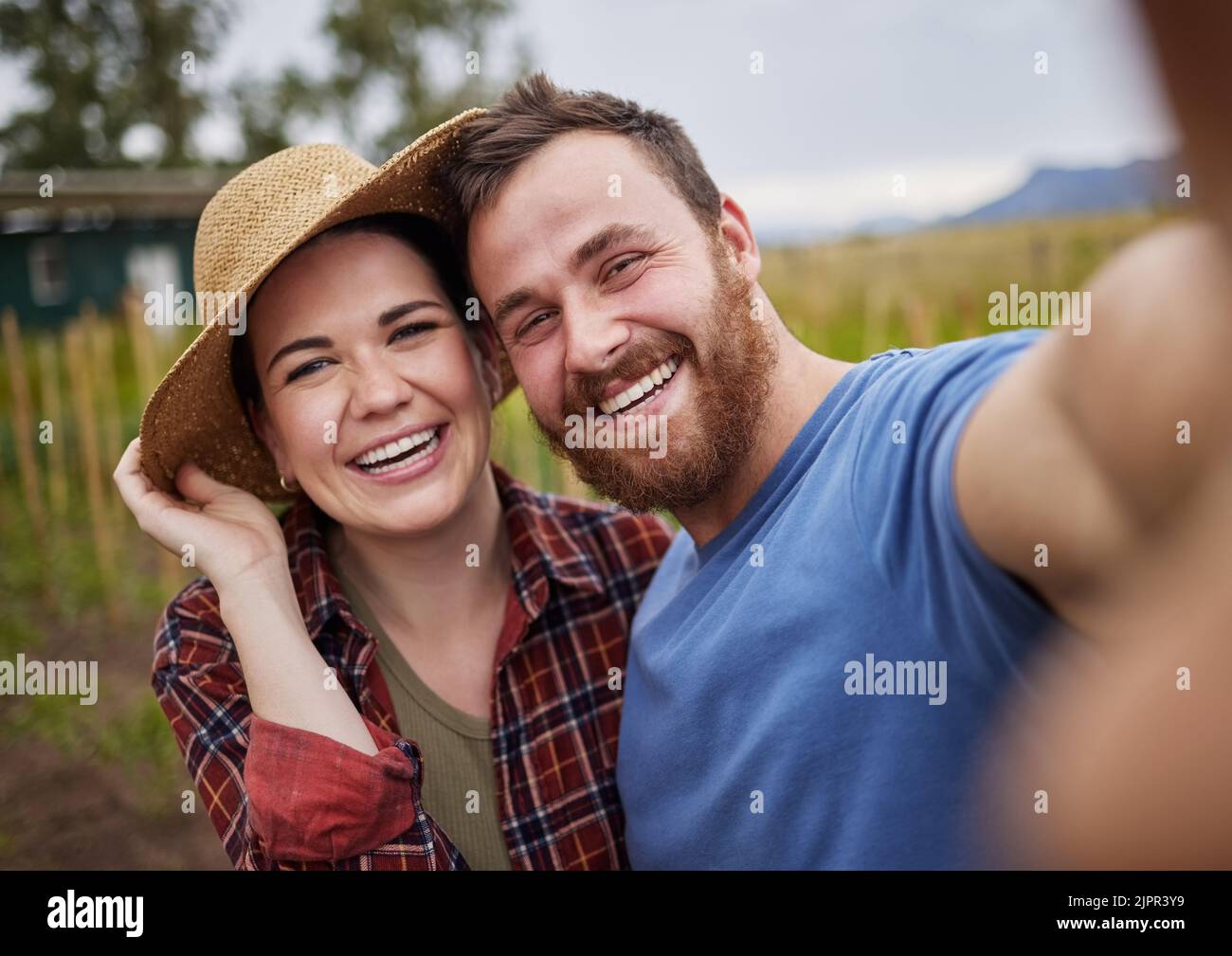 Smile, selfie and nature of happy couple in the countryside smiling ...