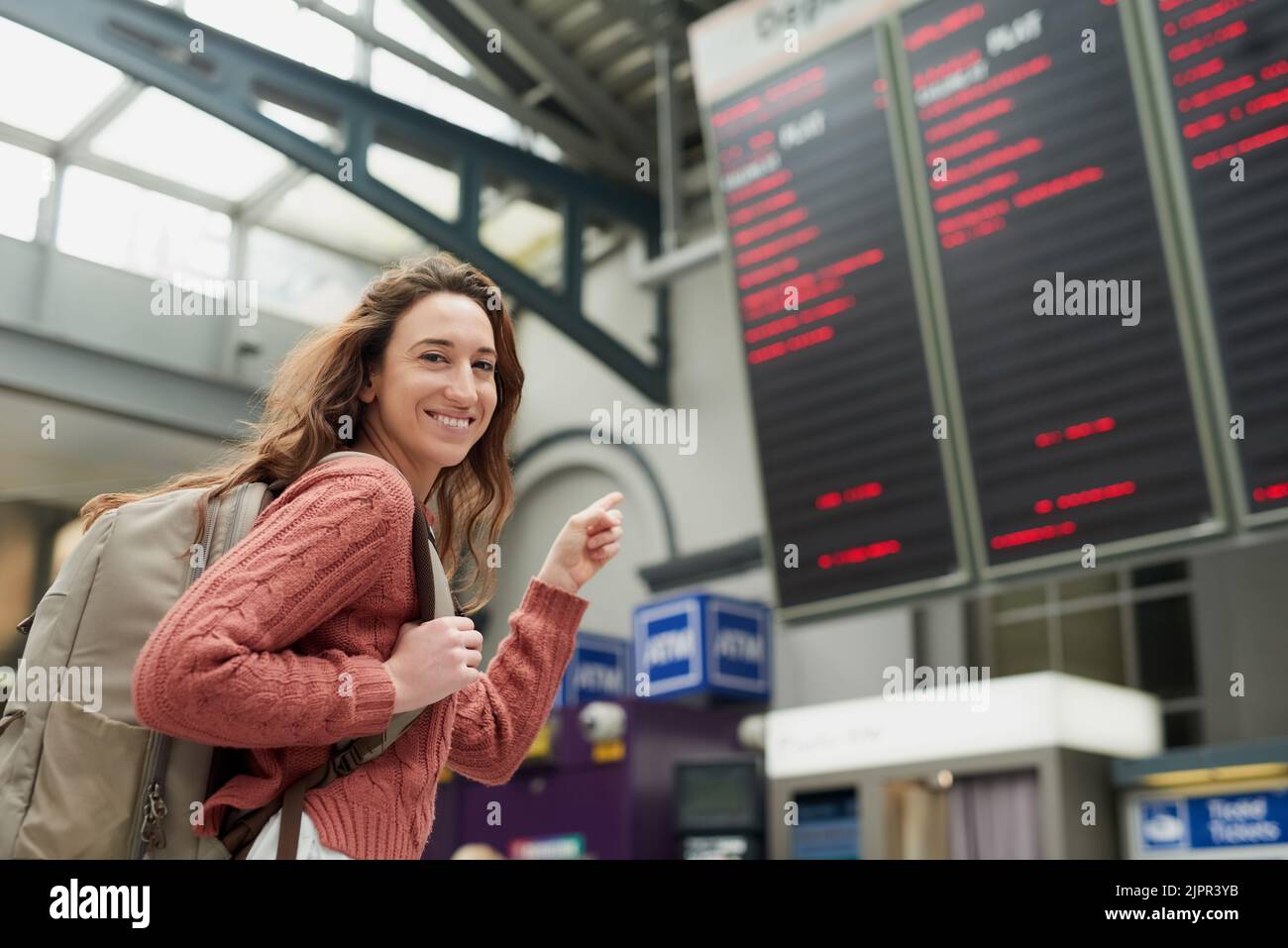 My flights boarding next. Low angle portrait of an attractive young ...