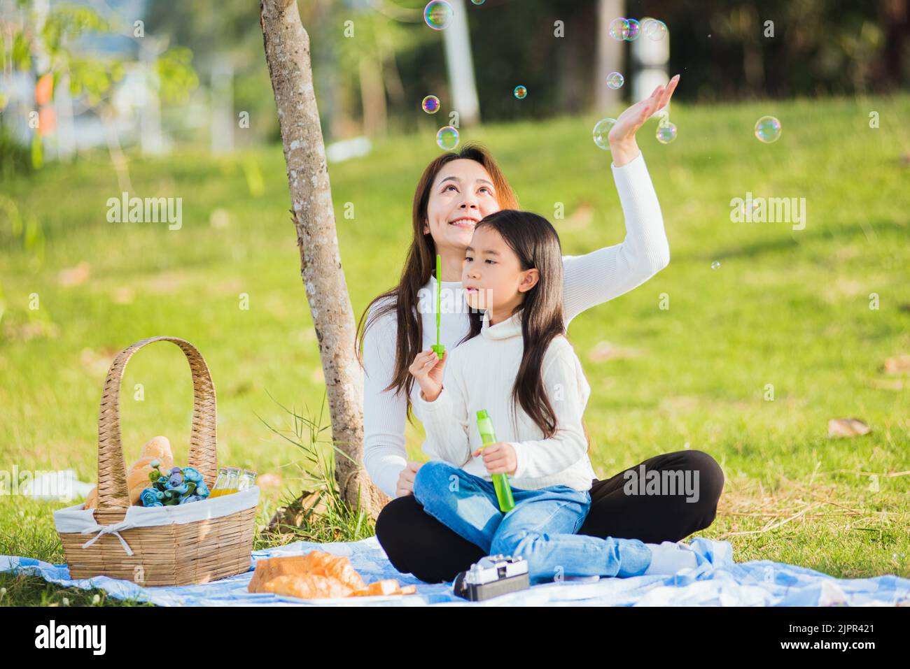 Happy Asian mother and little girl daughter child having fun and ...