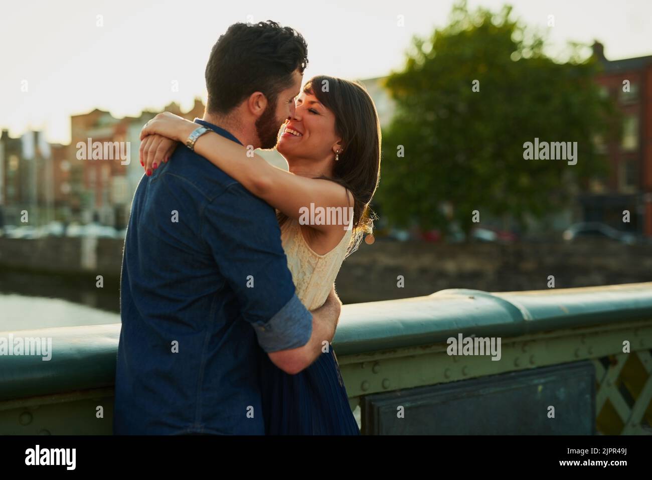 Falling in love. an affectionate young couple kissing while on a date ...