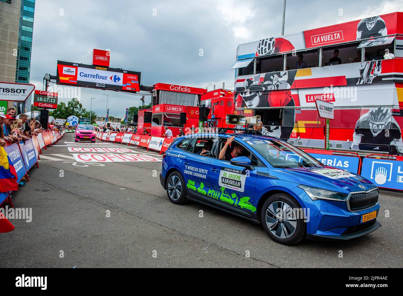 The Blue caravan is seen driving by before the tour started. La Vuelta ...