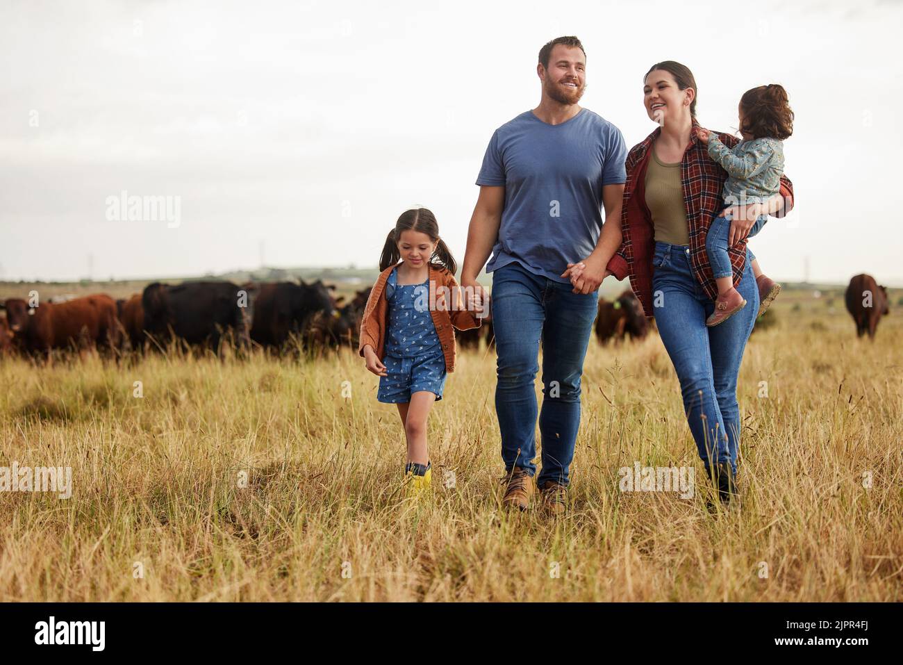 Farmer family, cow farm and bonding mother, father and children on ...