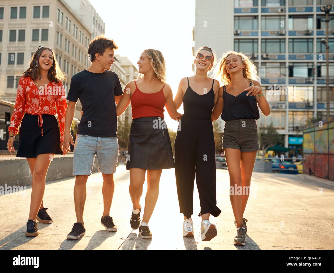 Travelling the city by foot. Full length shot of a group of young ...
