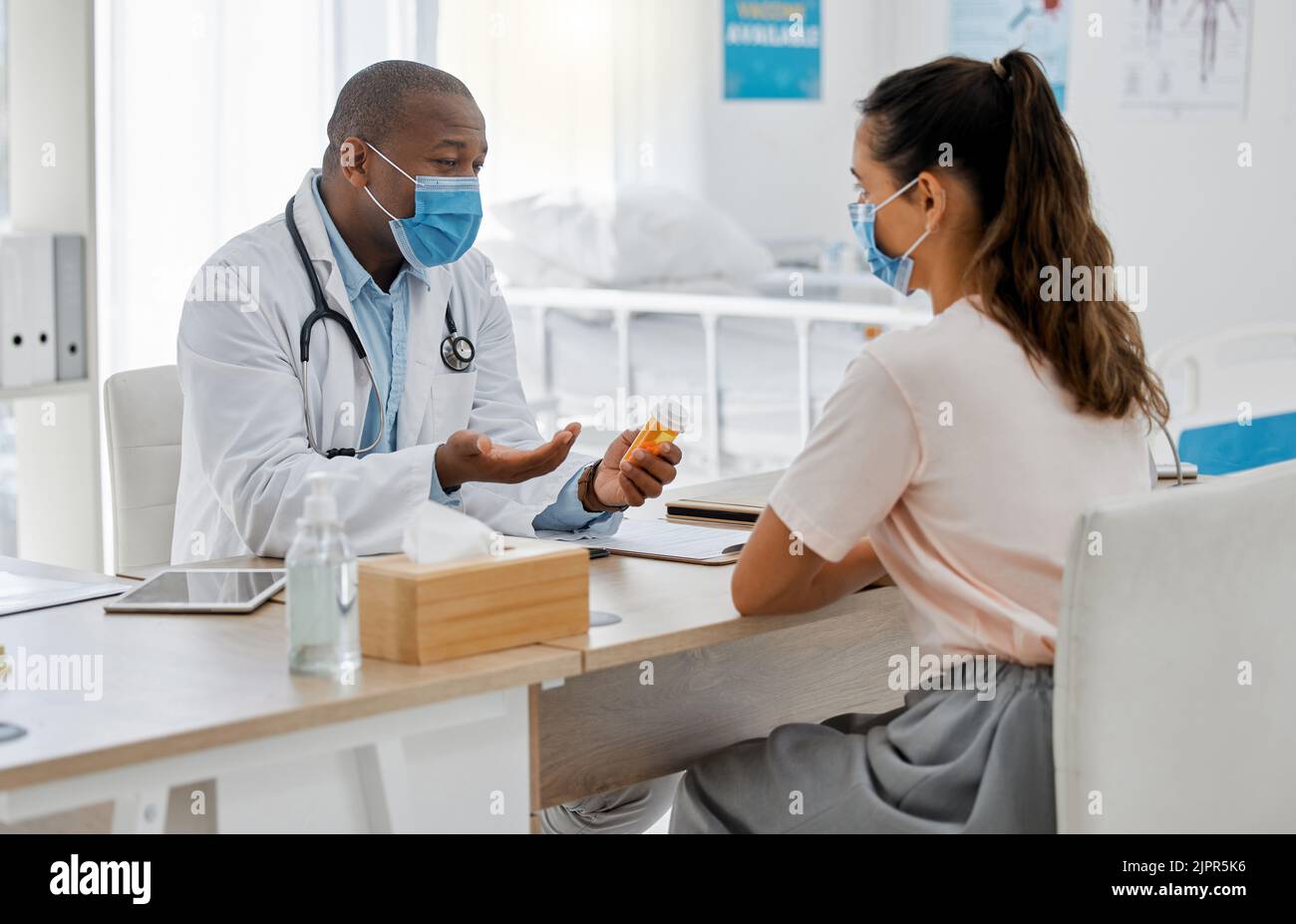 Talking doctor, covid patient and pills or medicine in medical ...