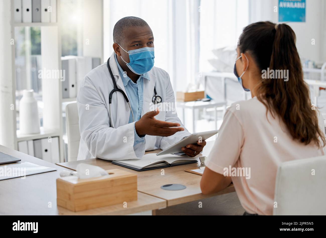 Doctors office, masks and sick patient consulting healthcare medic for ...