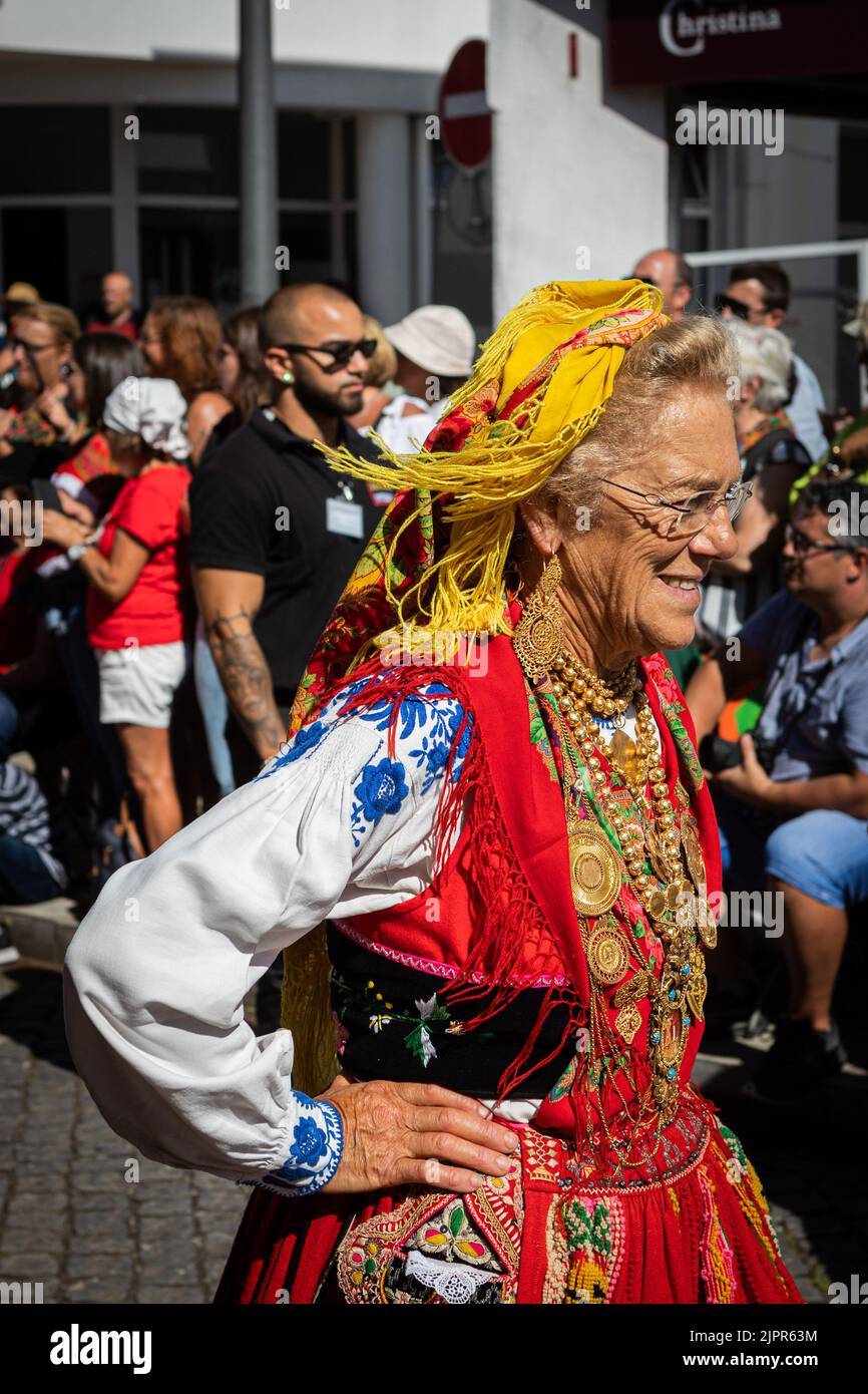 Portrait of an elderly woman wearing the traditional red costume. More ...