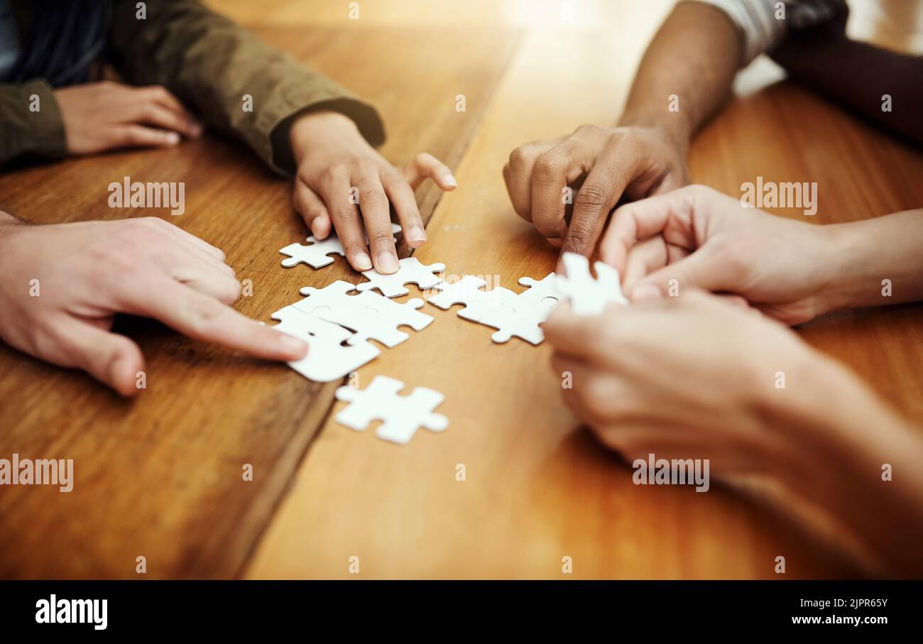 Teamwork gets the job done. High angle shot of a group of ...