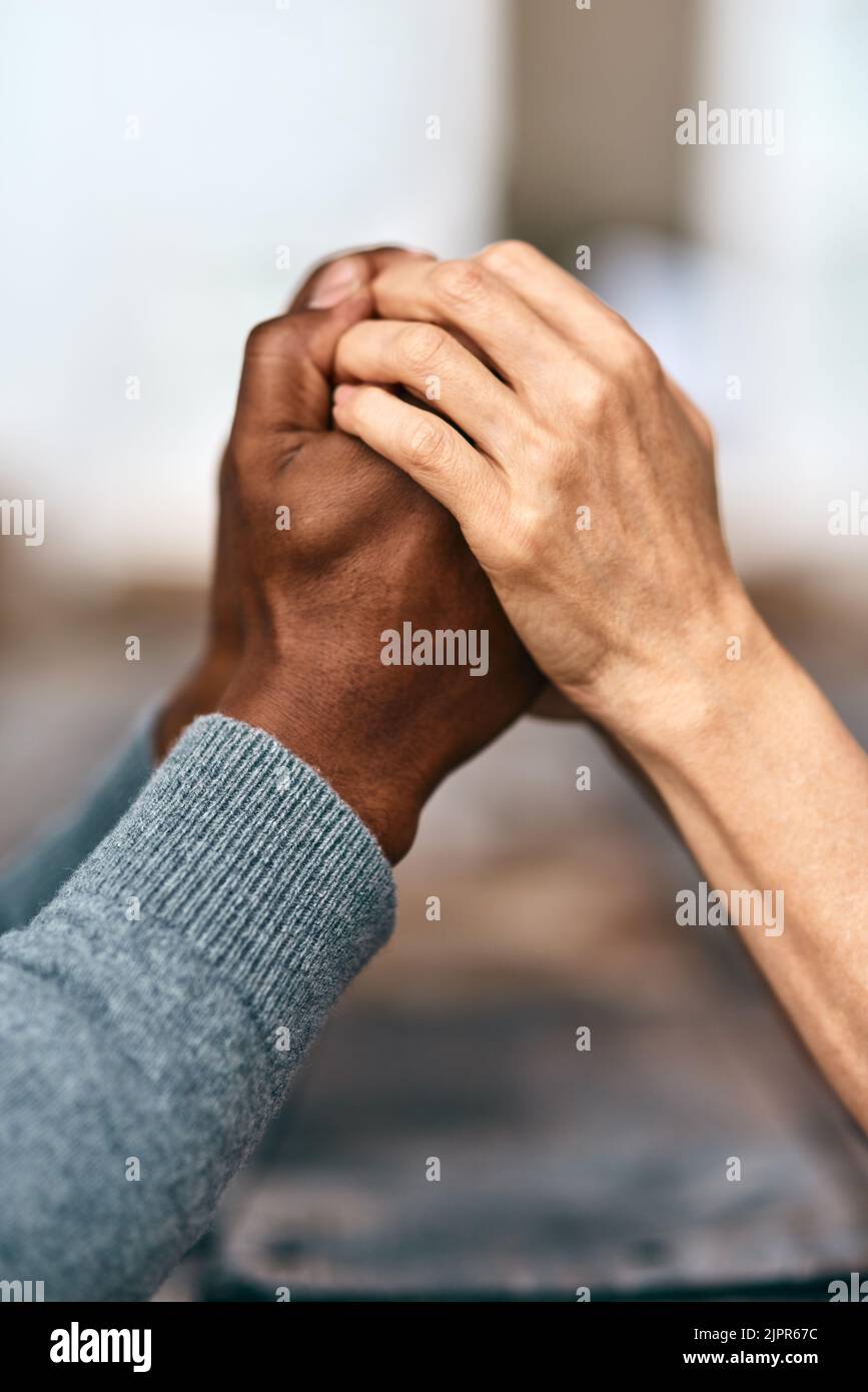 Two hearts that beat as one. two unrecognizable people holding hands ...