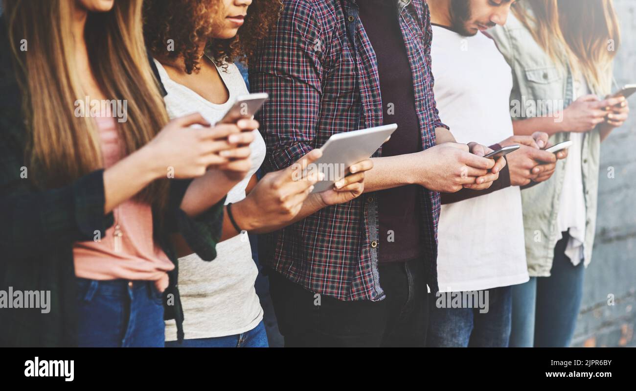 The current way to connect. a group of young people using their ...