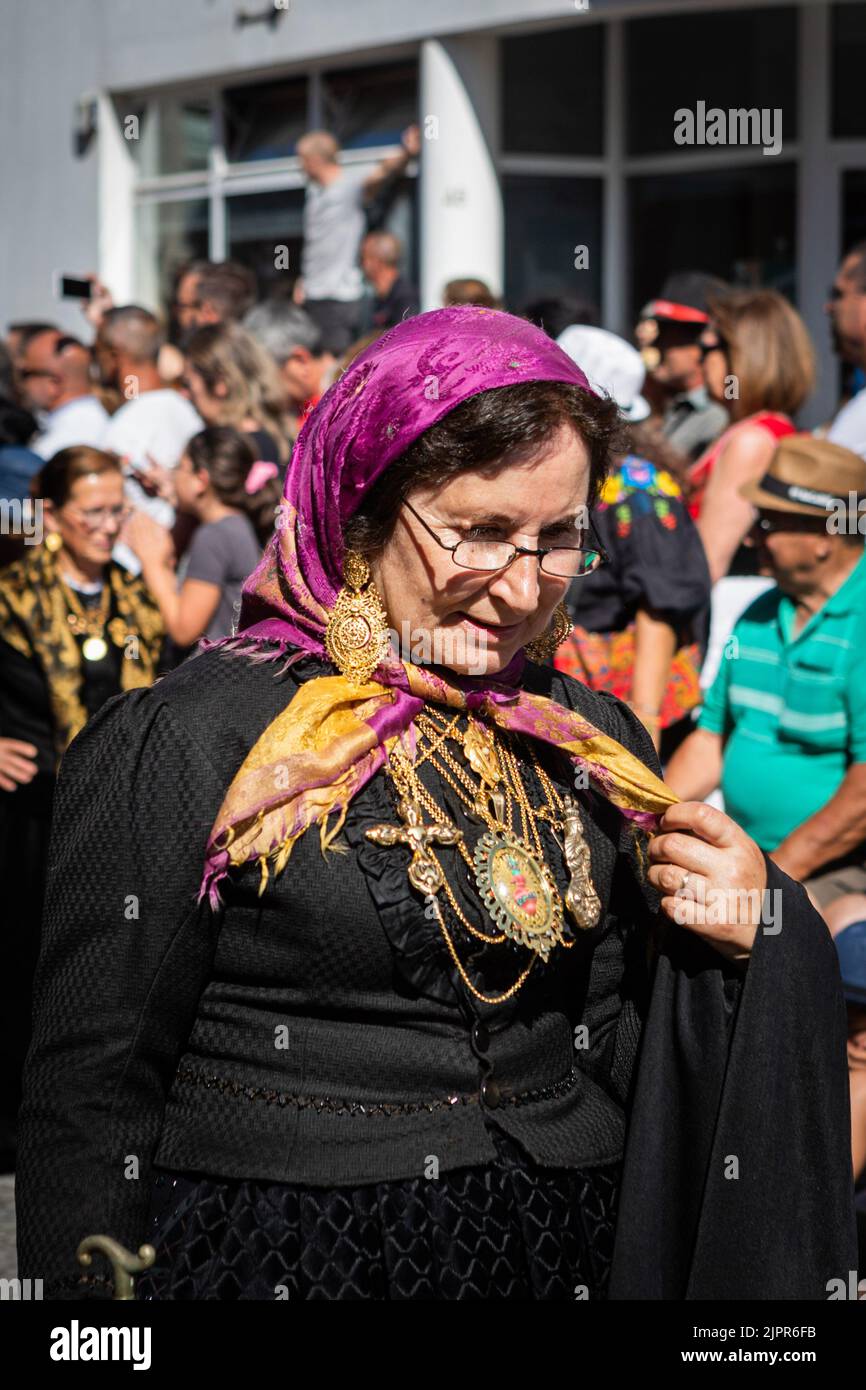 Portrait of a mordoma with a purple headpiece. More than half a ...