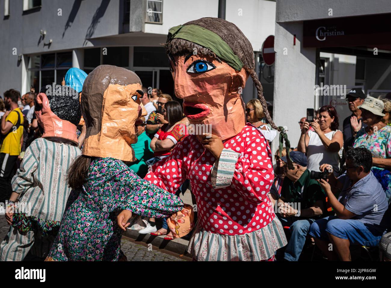 Giants and Big-headed Puppets dance around the streets opening the ...