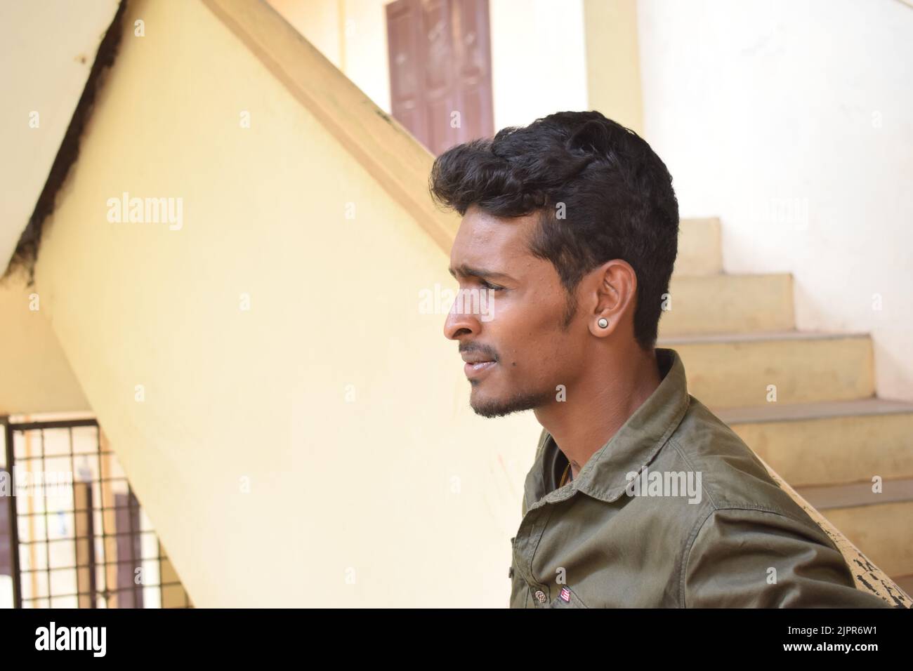 India college boy posing for a photo at college Stock Photo - Alamy