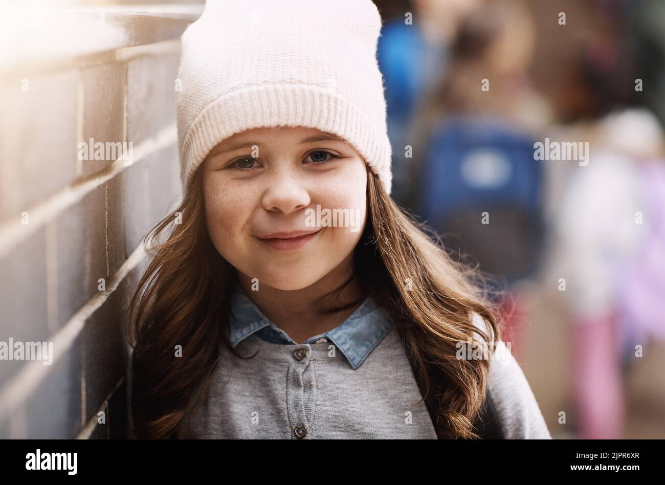 Smiling all the way to her next class. Cropped portrait of an ...
