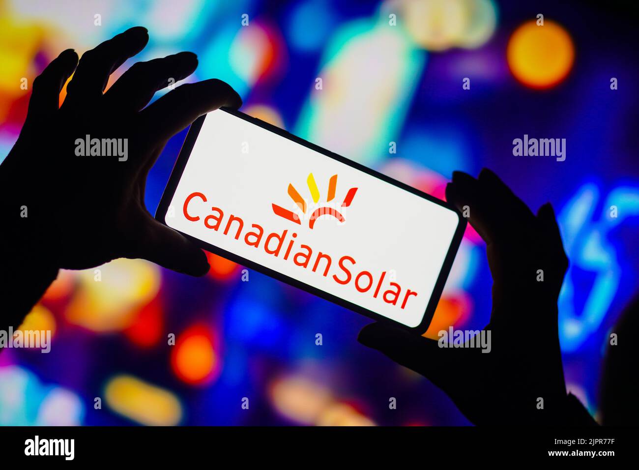In this photo illustration, the Canadian Solar logo is displayed on a ...