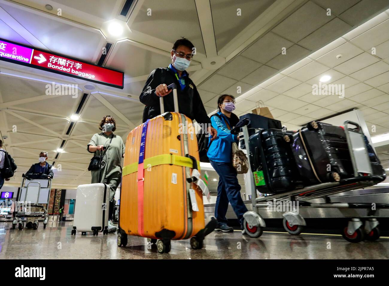 Taoyuan, Taoyuan, Taiwan. 19th Aug, 2022. Arriving passengers wearing ...